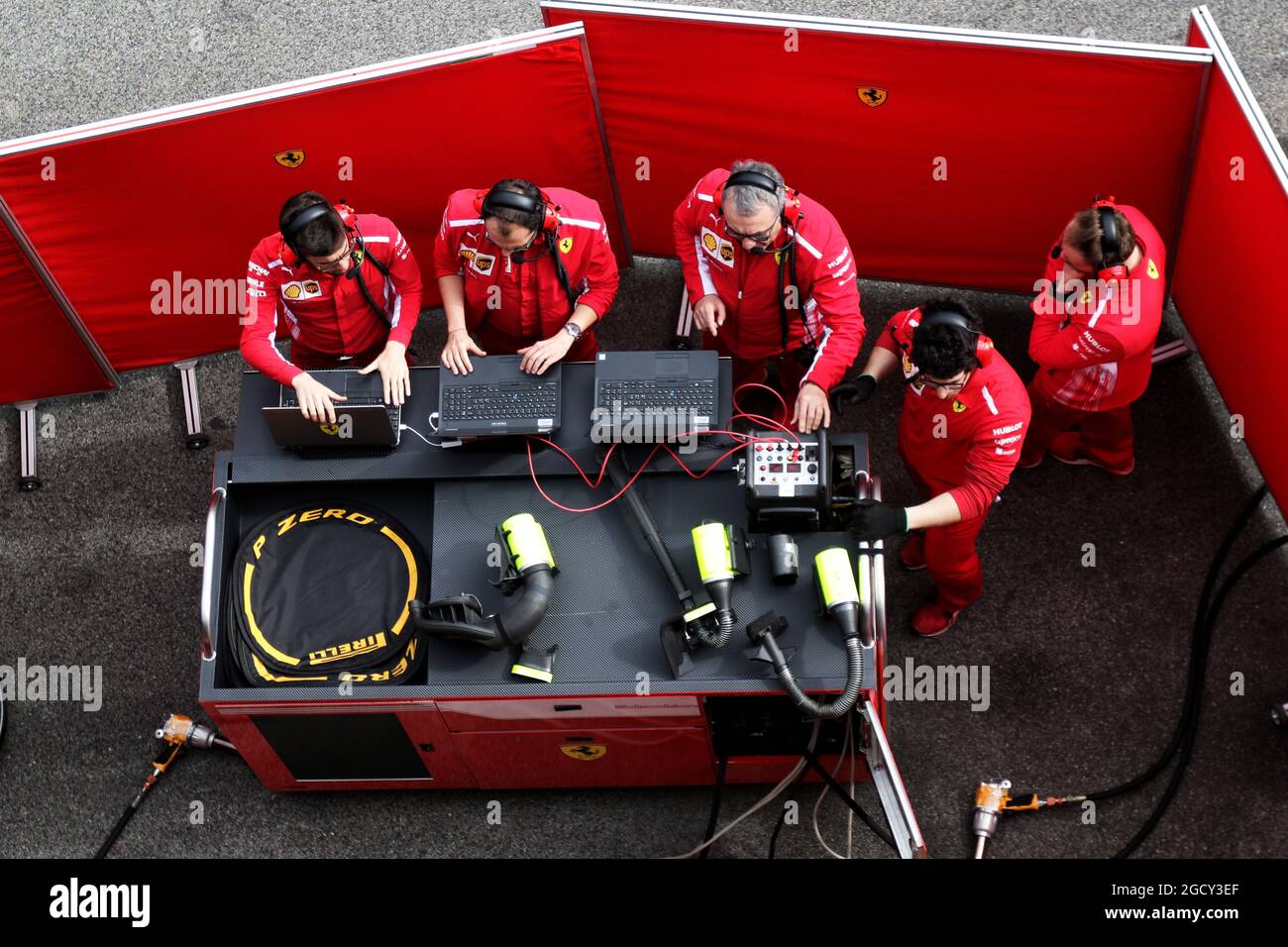 Ferrari engineers behind screens in pits hi-res stock photography and ...