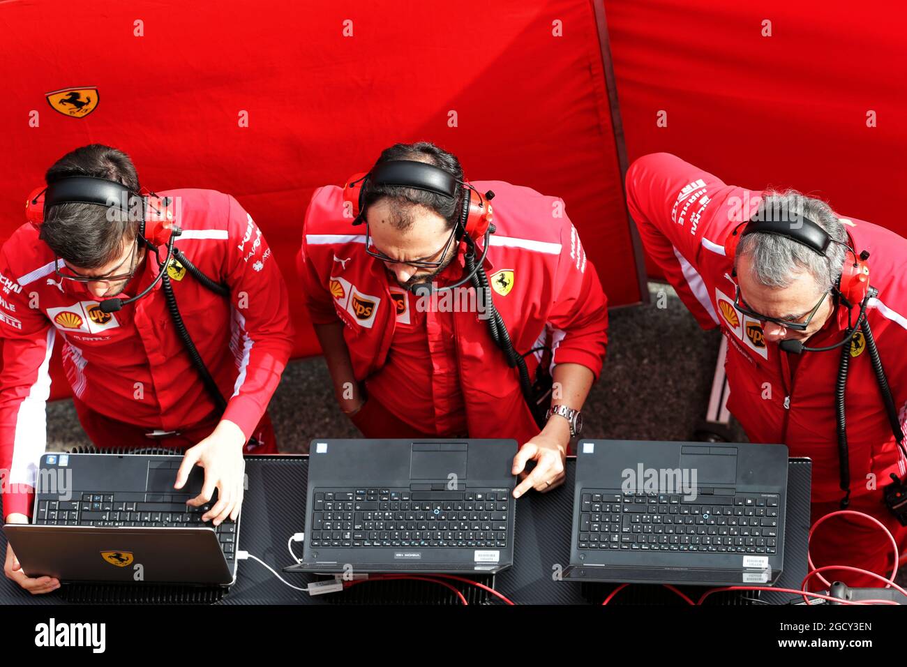 Ferrari engineers behind screens in pits hi-res stock photography and ...