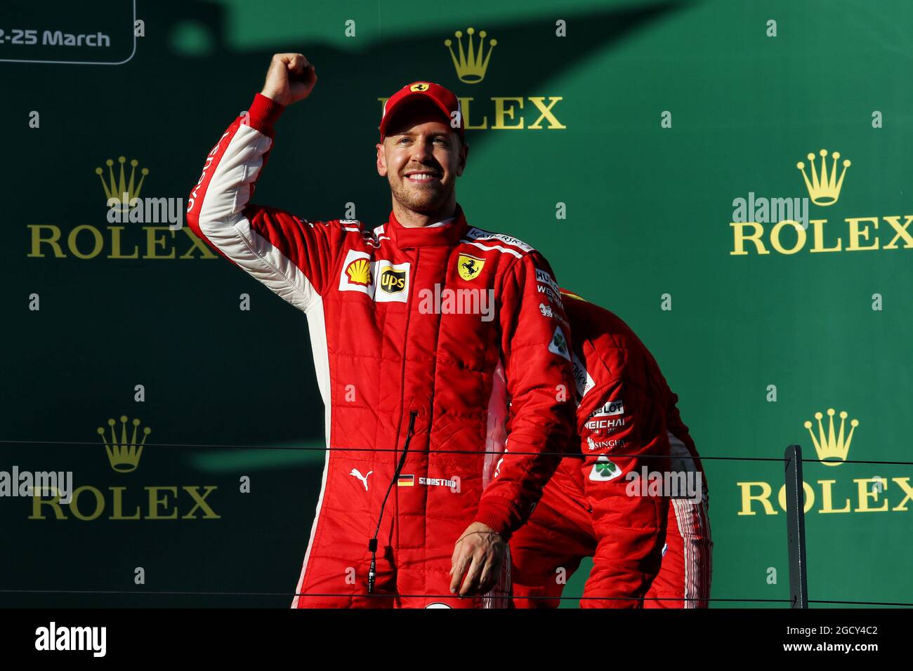 Race winner Sebastian Vettel (GER) Ferrari celebrates on the podium ...