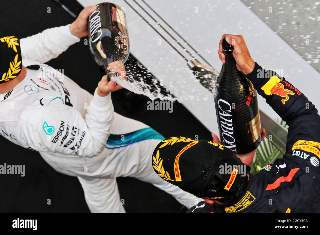 Mercedes amg f1 celebrates on podium second placed daniel ricciardo hi ...