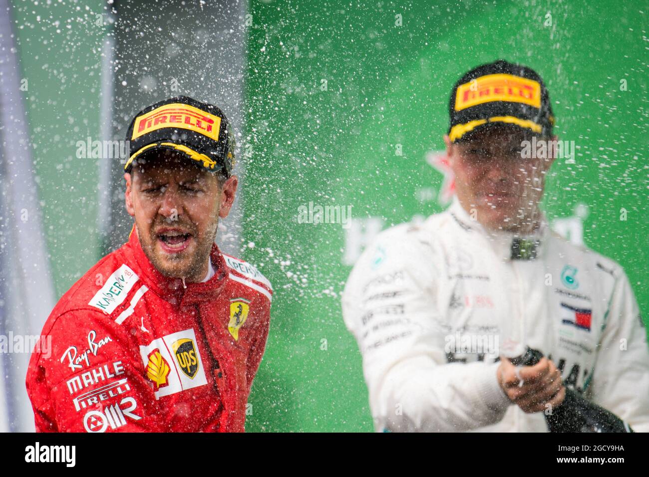 Race winner Sebastian Vettel (GER) Ferrari celebrates on the podium ...