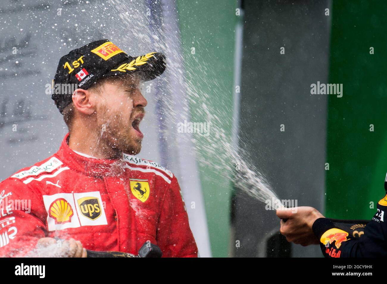 Race winner Sebastian Vettel (GER) Ferrari celebrates on the podium ...