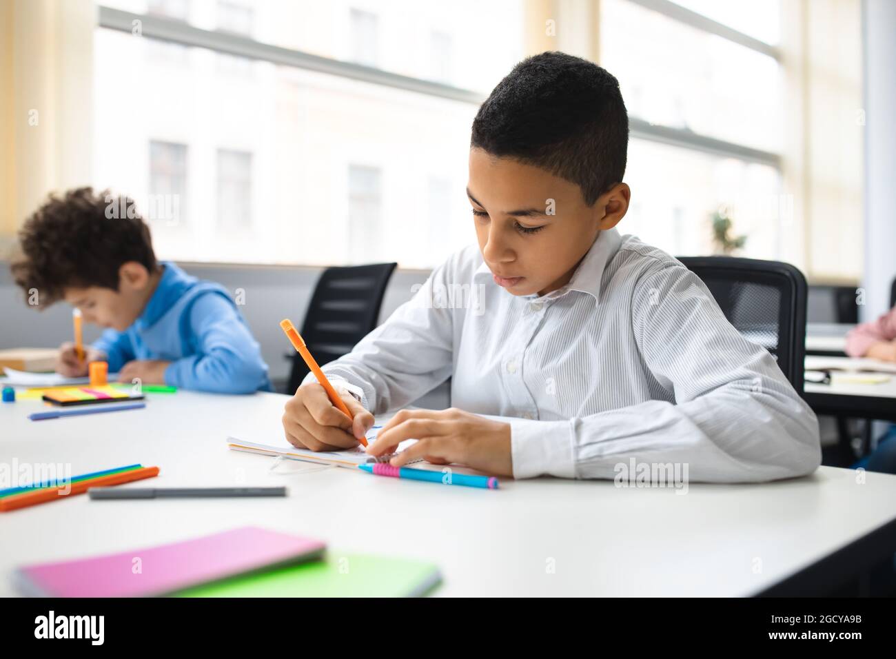 Boy writing diary hi-res stock photography and images - Alamy