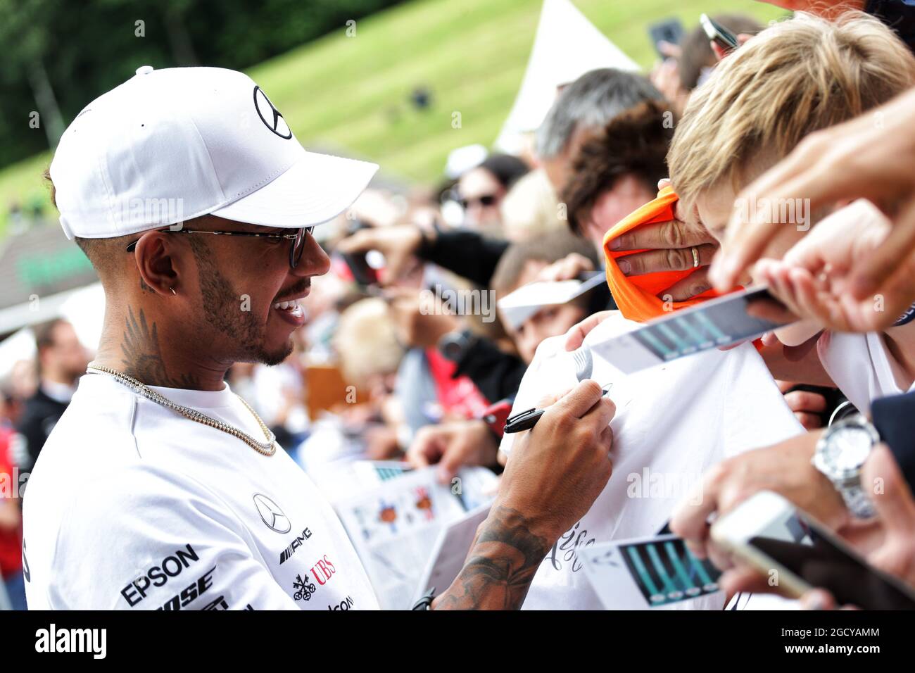 Lewis Hamilton (GBR) Mercedes AMG F1 signs autographs for the fans ...