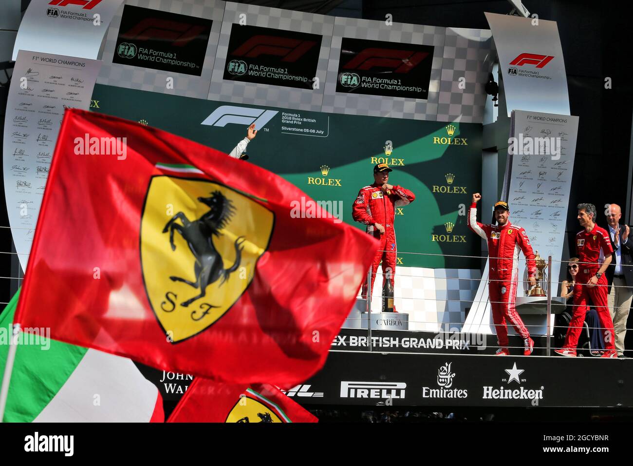 Race winner Sebastian Vettel (GER) Ferrari celebrates on the podium ...