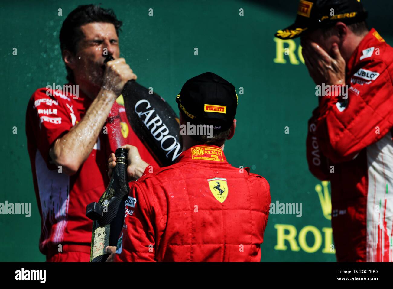 Race winner Sebastian Vettel (GER) Ferrari celebrates on the podium ...