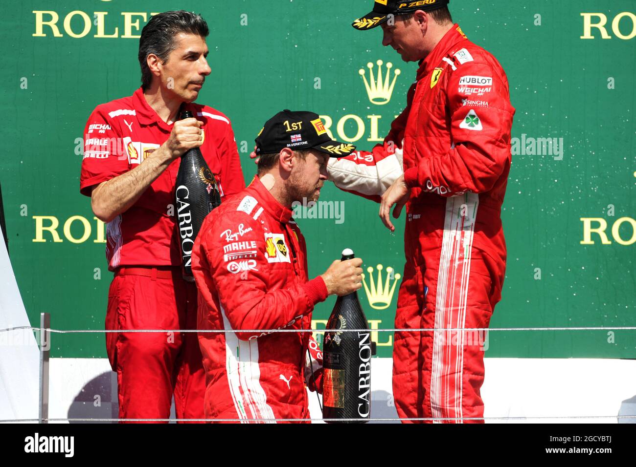 Race winner Sebastian Vettel (GER) Ferrari celebrates on the podium ...