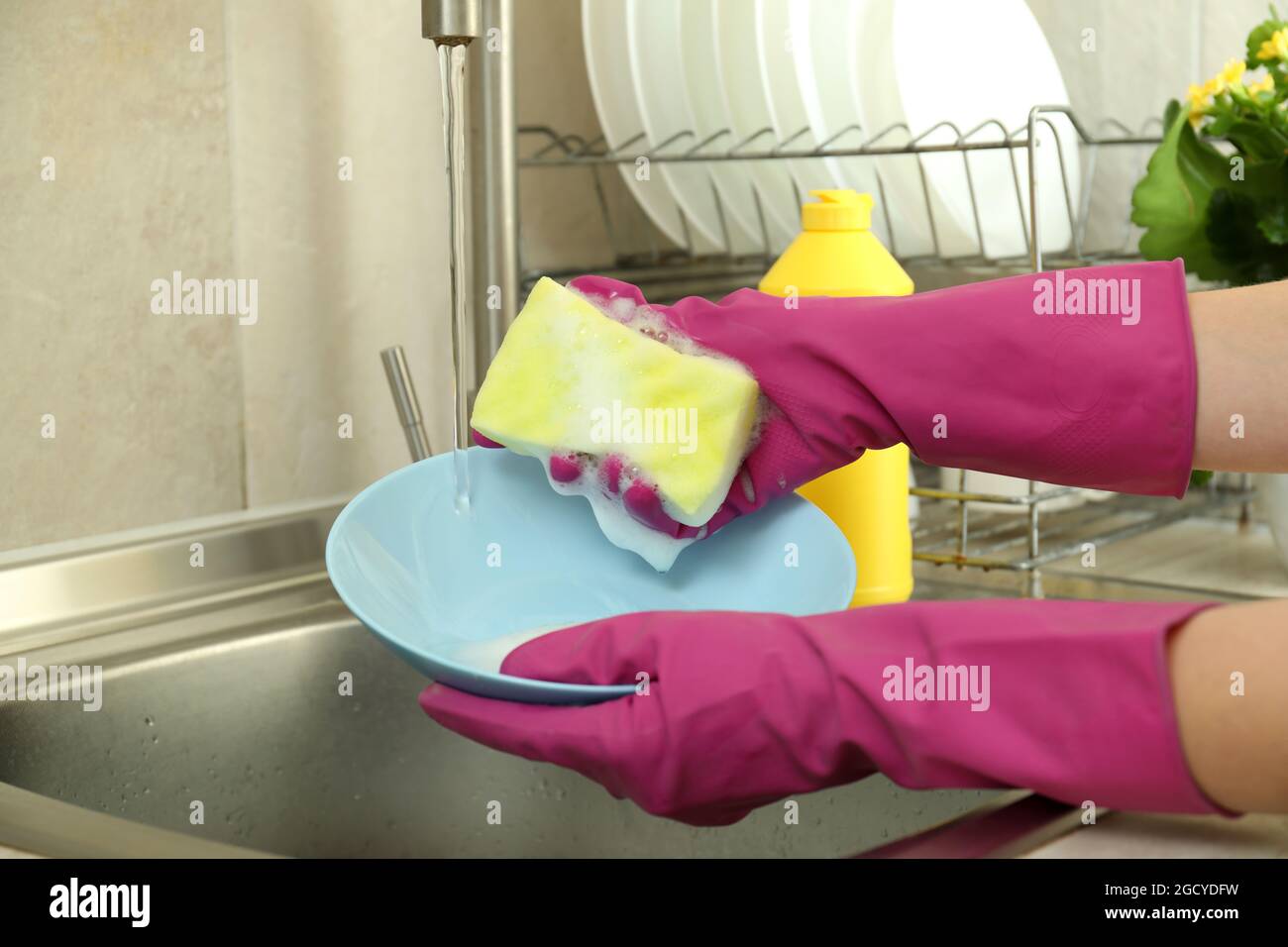 Concept of dishwashing on kitchen basin background Stock Photo - Alamy