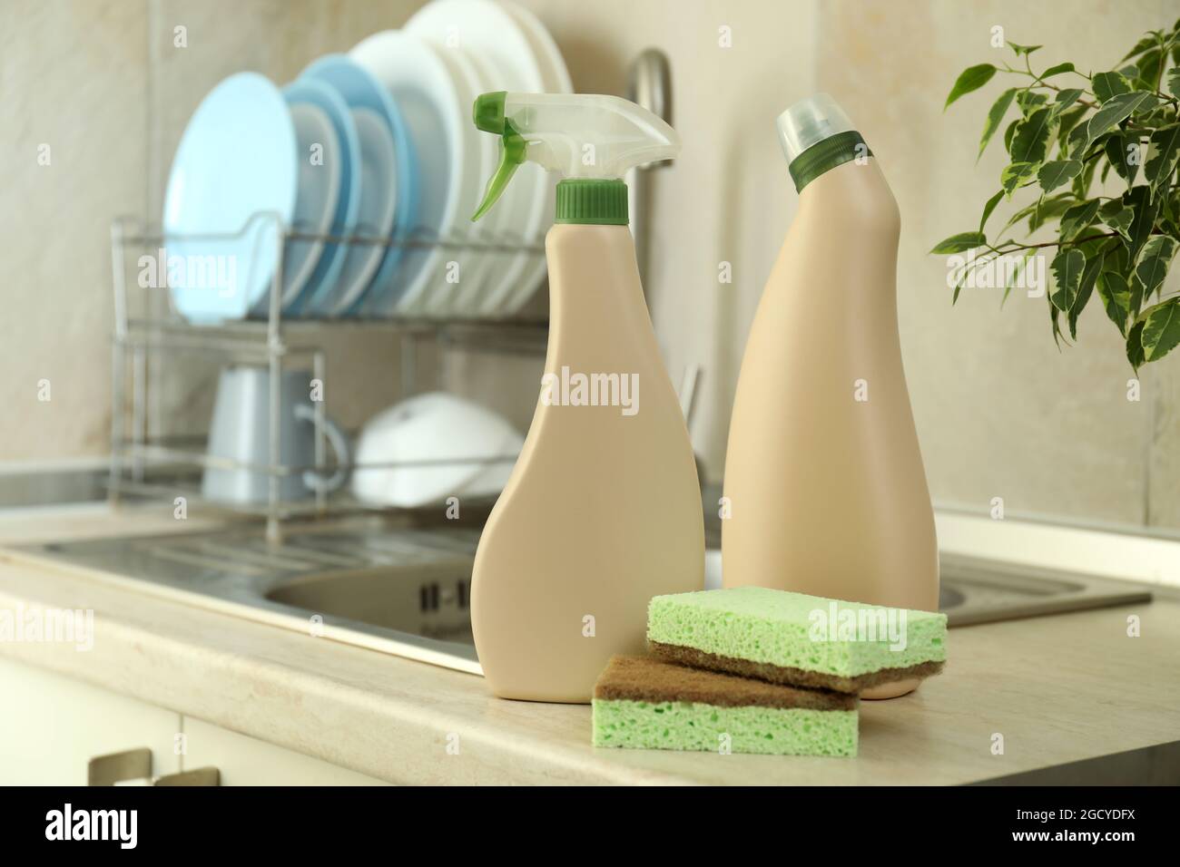 Concept of Dishwashing detergent accessories on kitchen background ...