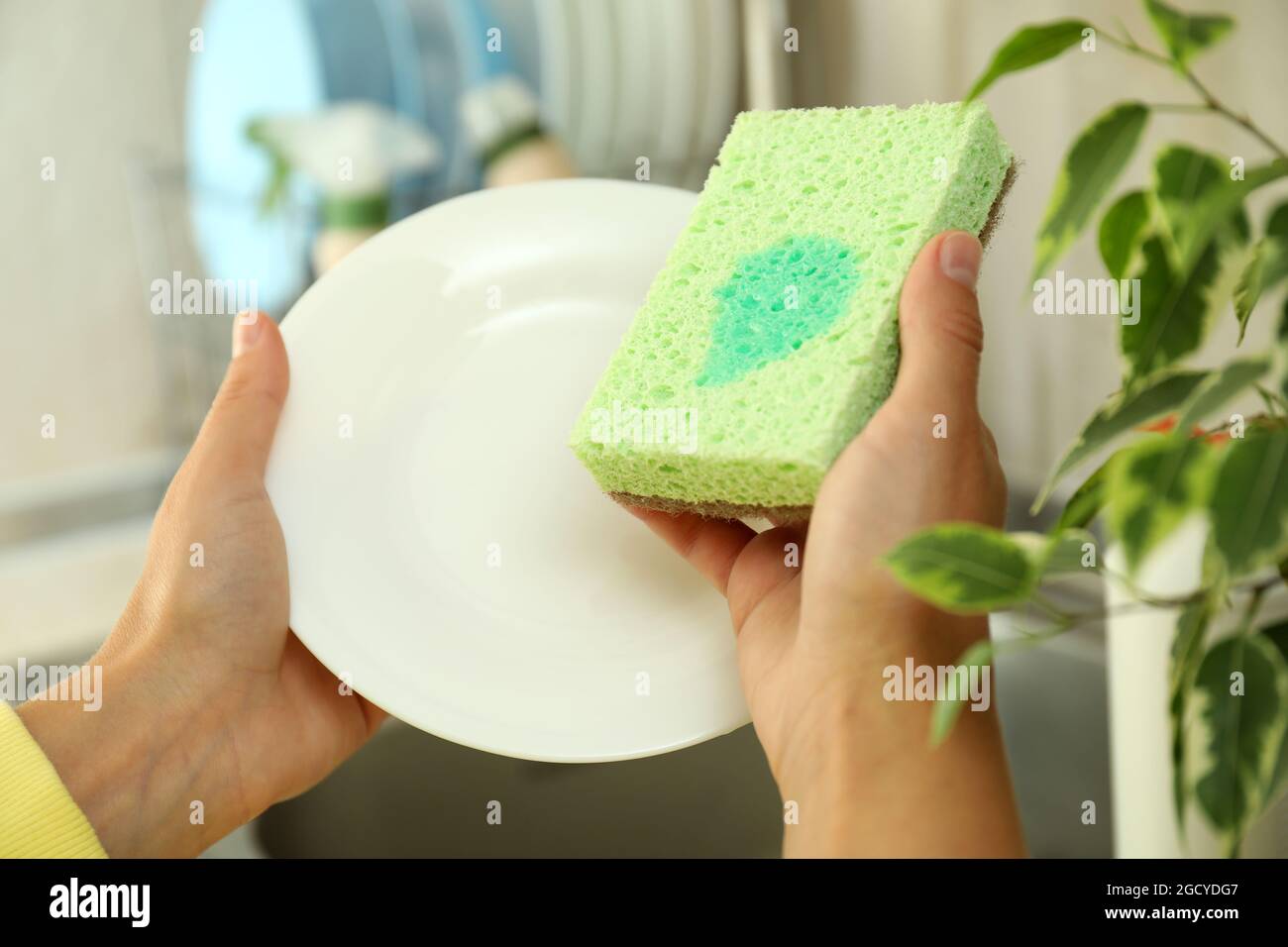 Concept of dishwashing on kitchen basin background Stock Photo - Alamy