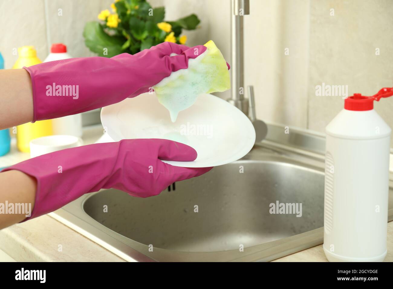 Concept of dishwashing on kitchen basin background Stock Photo - Alamy