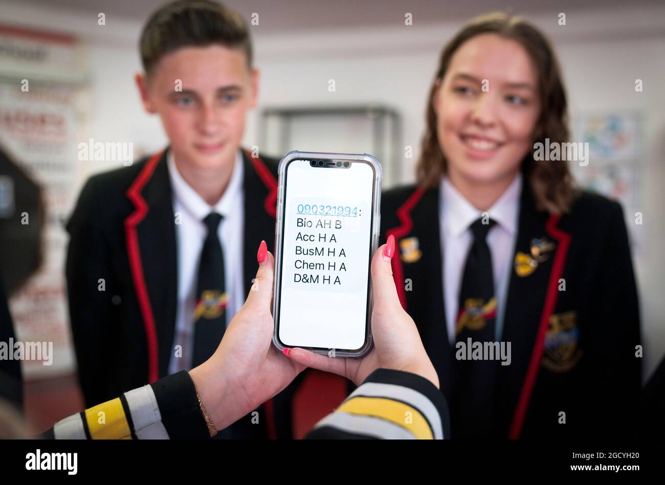 Students at Lochgelly High School in Lochgelly, Fife, check their ...