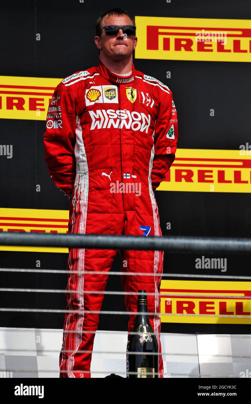 Race winner Kimi Raikkonen (FIN) Ferrari celebrates on the podium ...