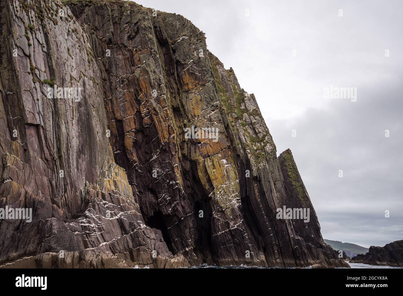 Dingle cliffs just outside the harbour area hi-res stock photography ...