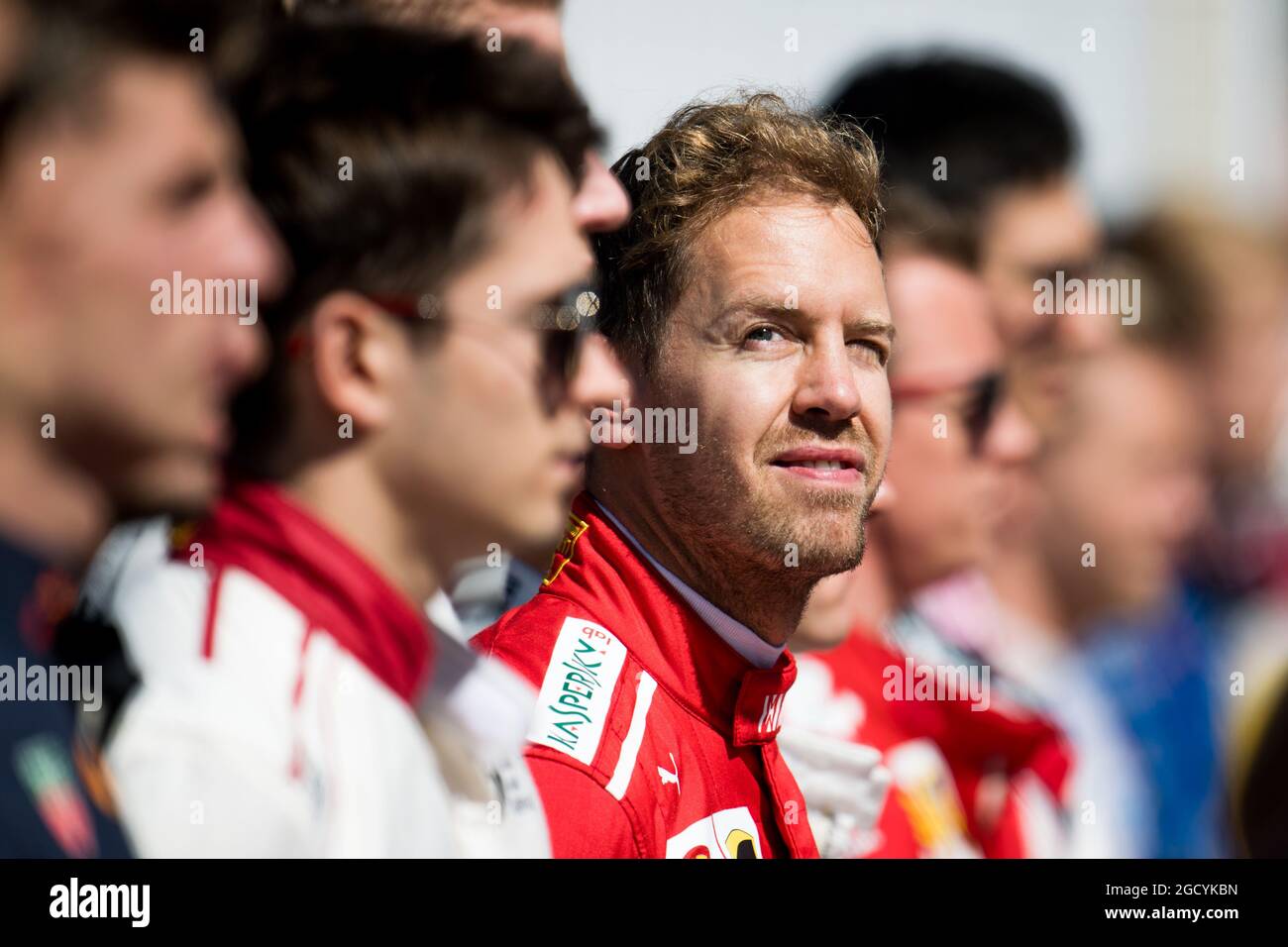 Sebastian Vettel (GER) Ferrari as the grid observes the national anthem ...