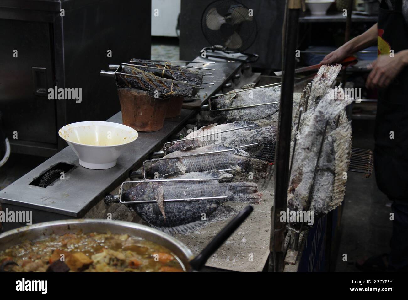 Fish in containers for frying; Bangkok street fast food, Thailand Stock ...