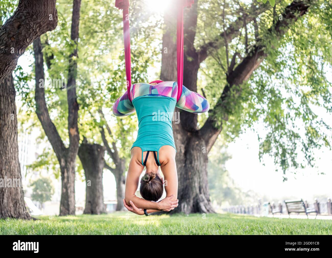 Girl doing fly yoga Stock Photo - Alamy