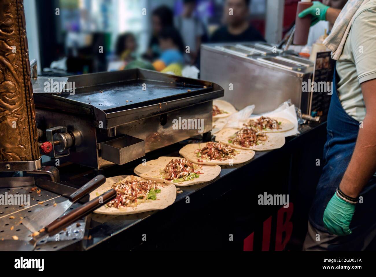 Preparation of Turkish shawarma. ready-made tortillas with cucumbers ...