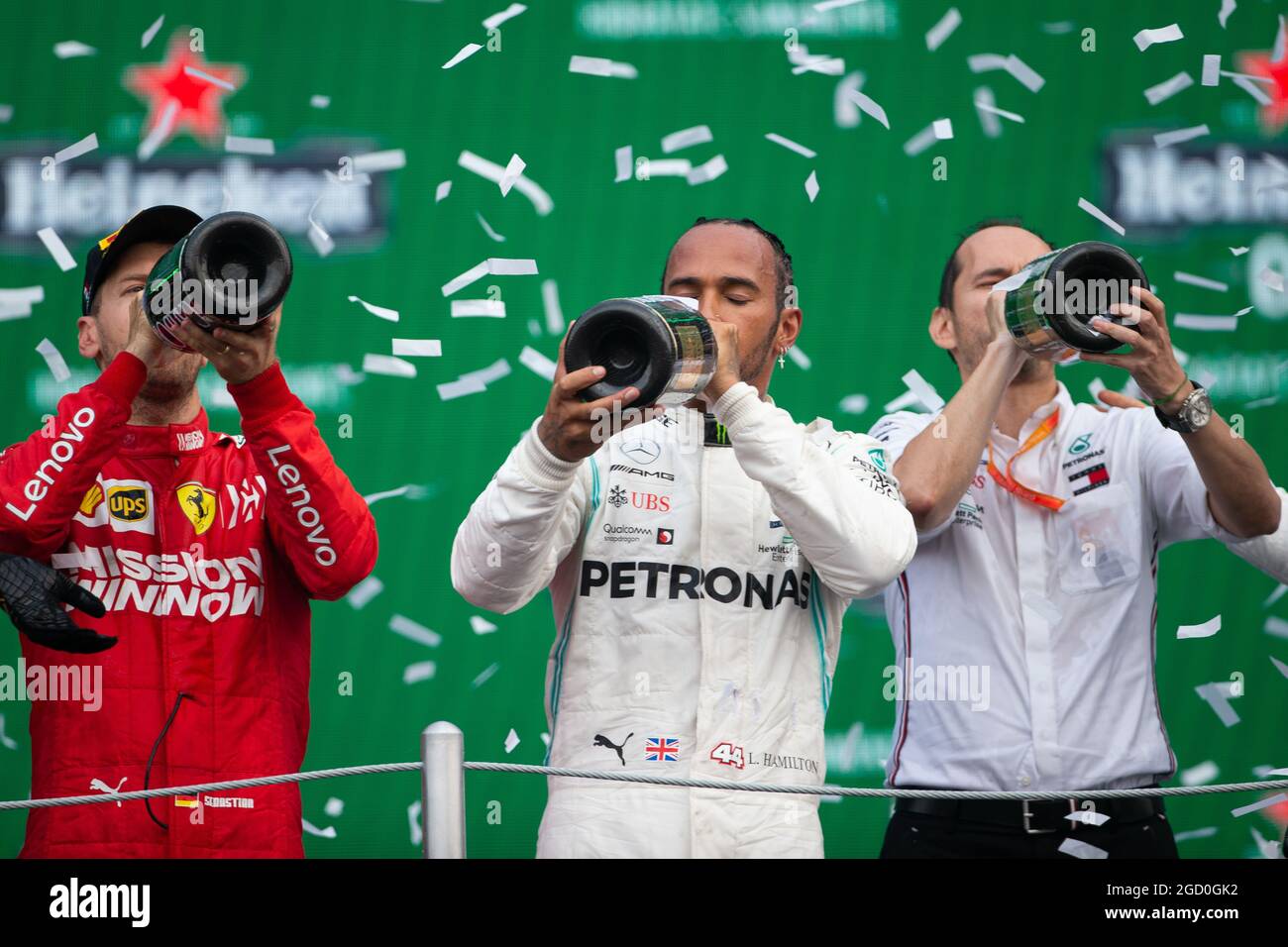 (L to R): Sebastian Vettel (GER) Ferrari and race winner Lewis Hamilton ...