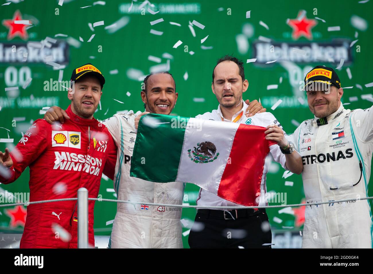 The podium (L to R): Sebastian Vettel (GER) Ferrari, second; Lewis ...