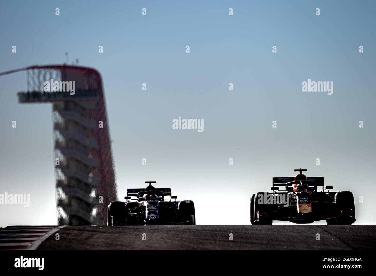 Daniil Kvyat (RUS) Scuderia Toro Rosso STR14 and Max Verstappen (NLD) Red Bull Racing RB15 ...