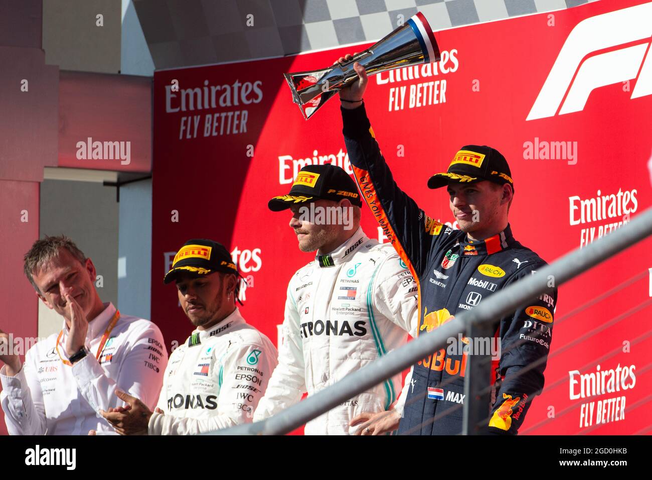 The podium (L to R): Lewis Hamilton (GBR) Mercedes AMG F1, second and ...