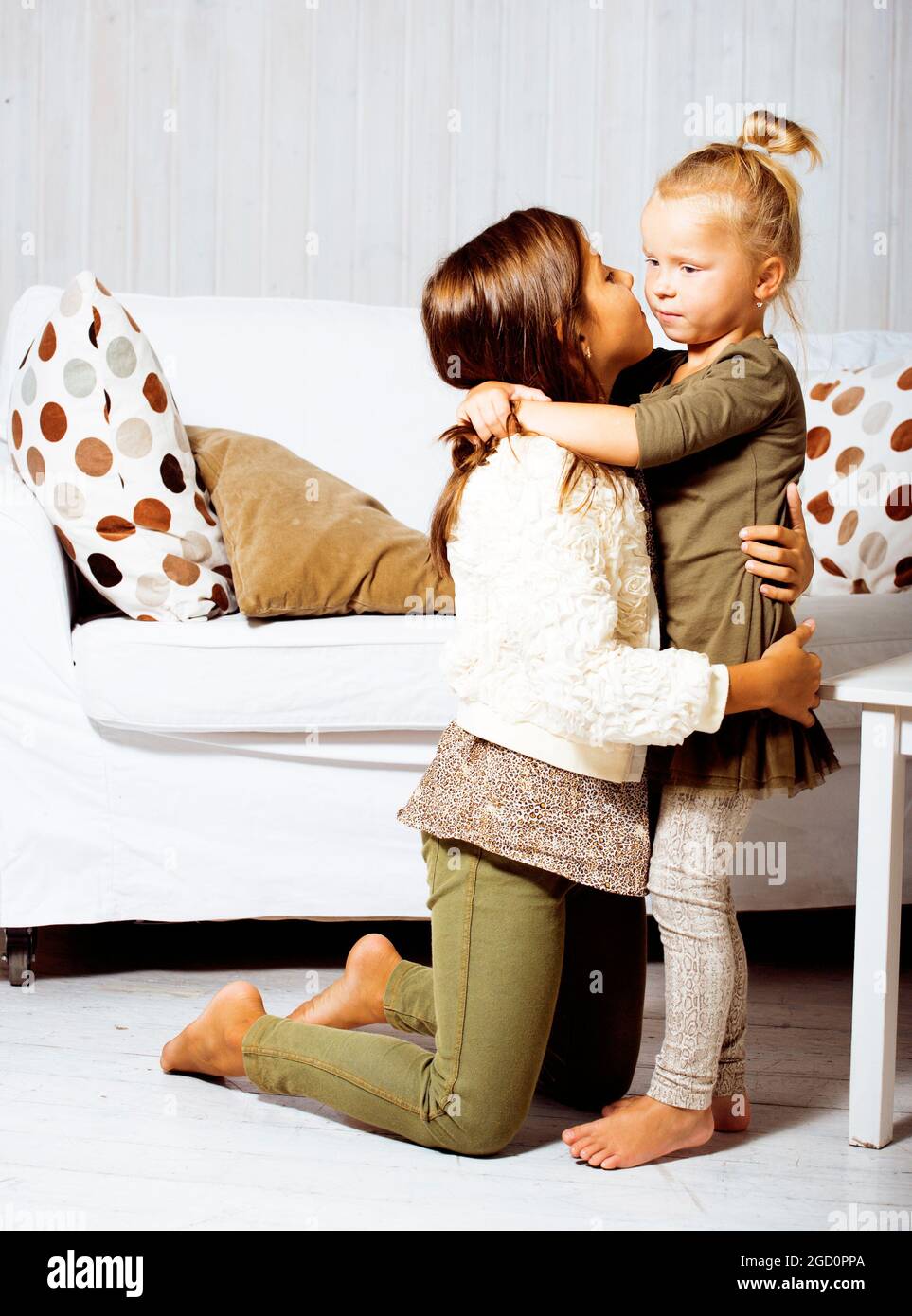 two cute sisters at home interior playing, little happy smiling girl in ...