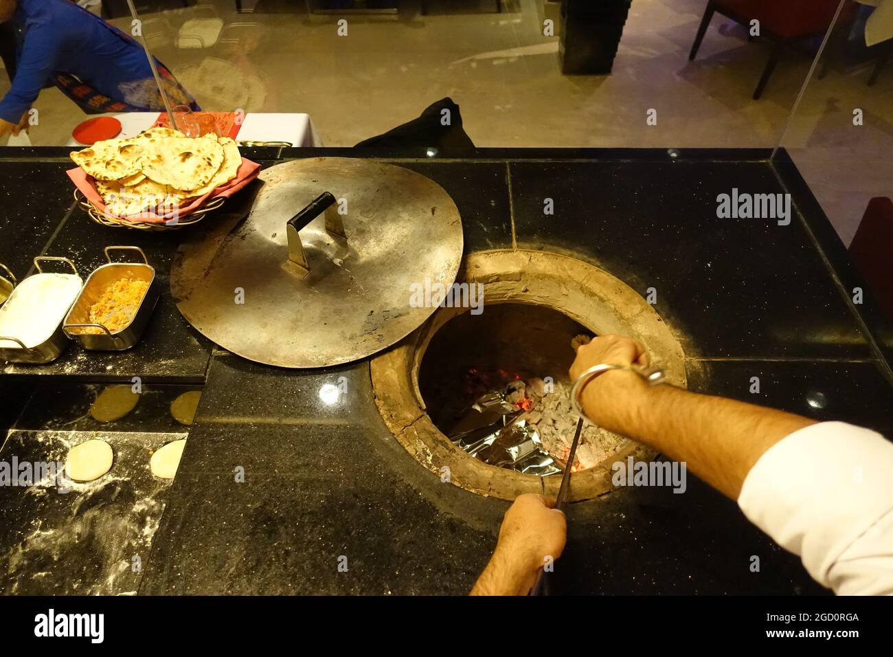 Demonstration of making Naan Bread by the Cook at the Ananta Indian ...