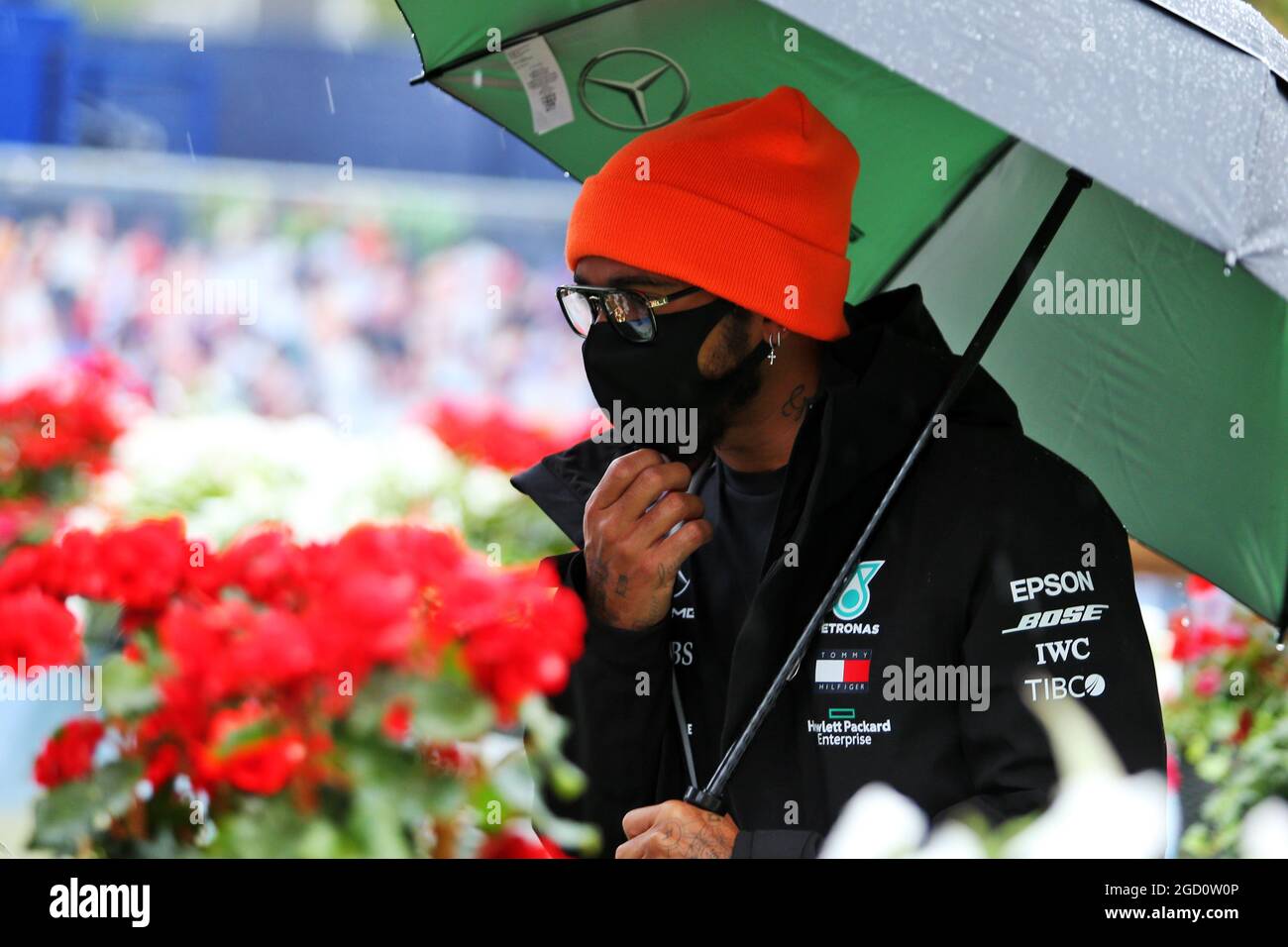 Lewis Hamilton (GBR) Mercedes AMG F1 - heavy rain in the paddock ...