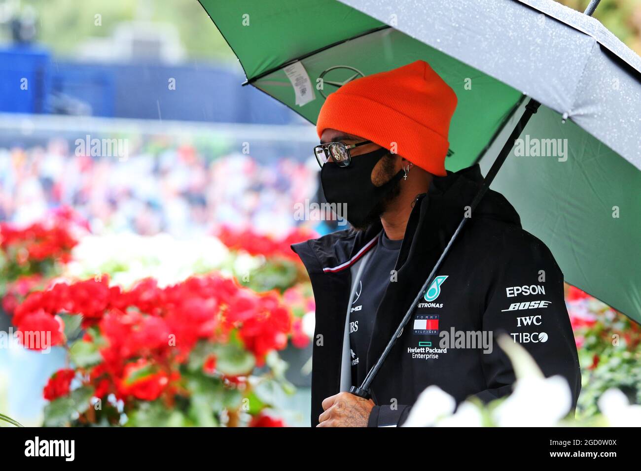 Lewis Hamilton (GBR) Mercedes AMG F1 - heavy rain in the paddock ...
