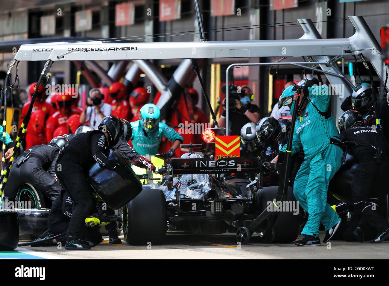 Lewis Hamilton (GBR) Mercedes AMG F1 W11 makes a pit stop. British ...