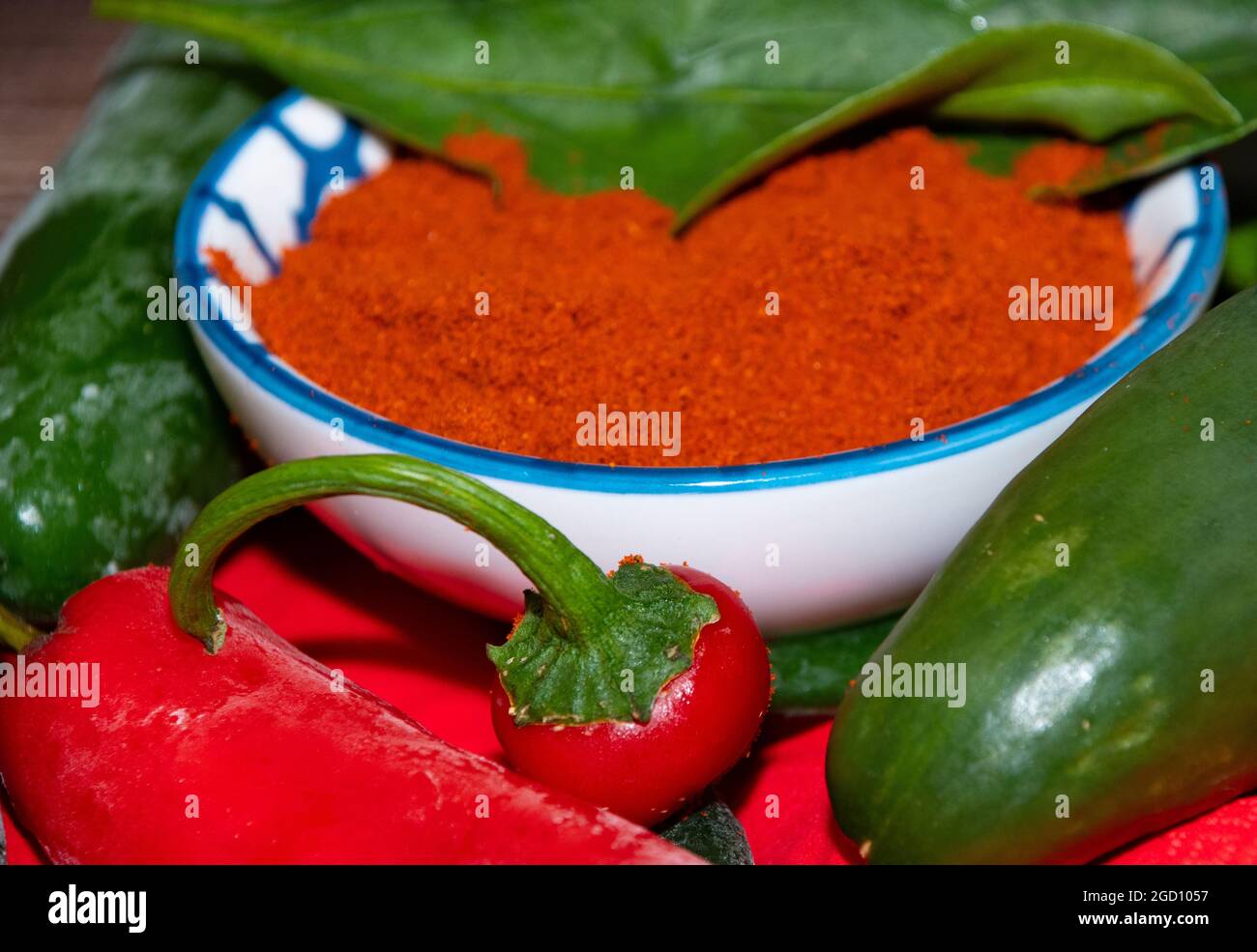 fresh grown chilli peppers and ground chilli Stock Photo - Alamy