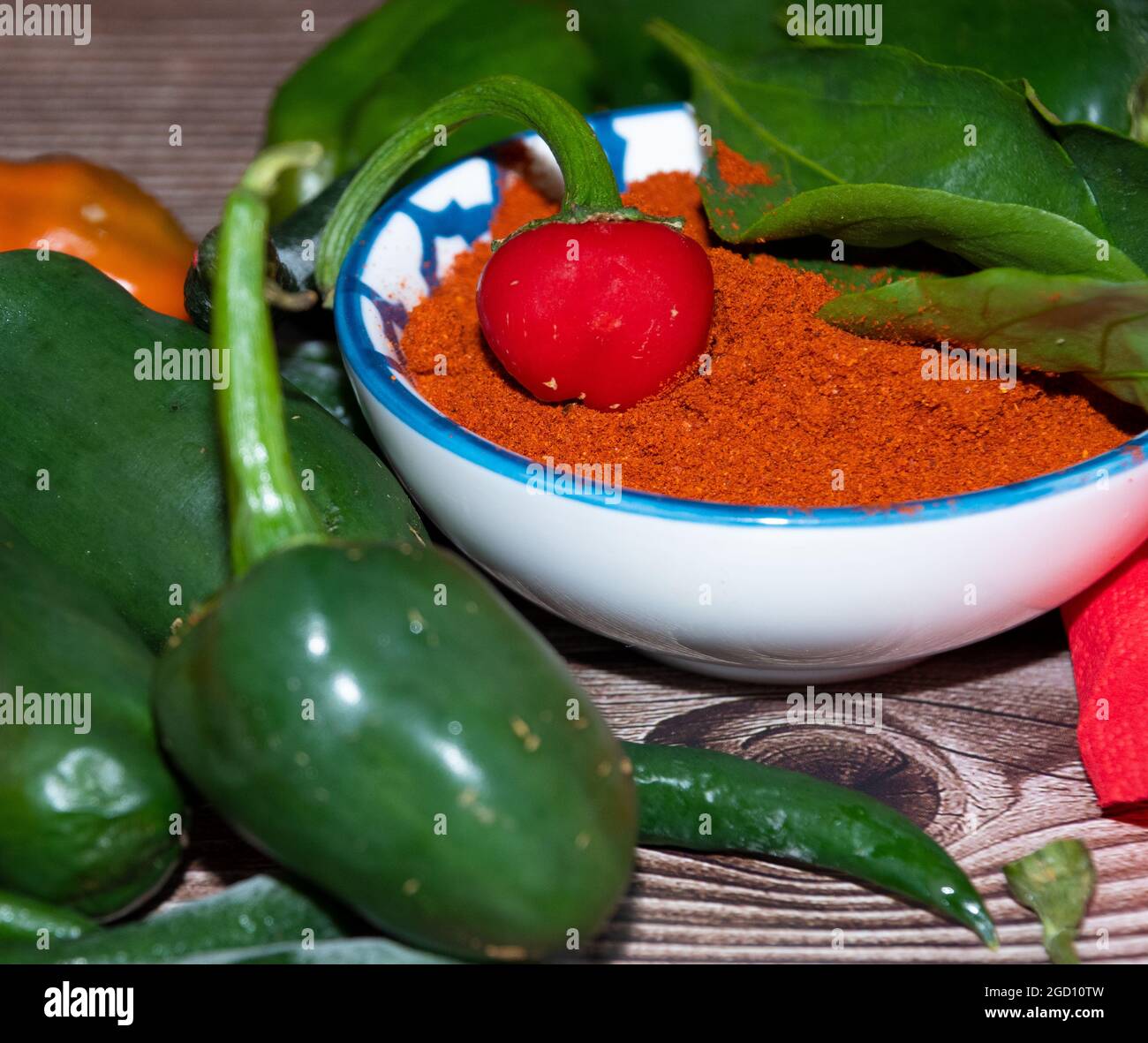 fresh grown chilli peppers and ground chilli Stock Photo - Alamy