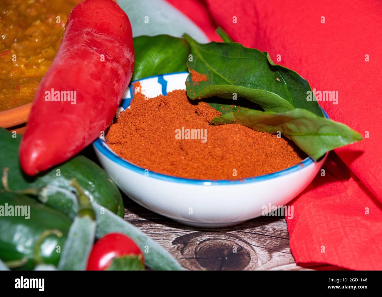 fresh grown chilli peppers and ground chilli Stock Photo - Alamy