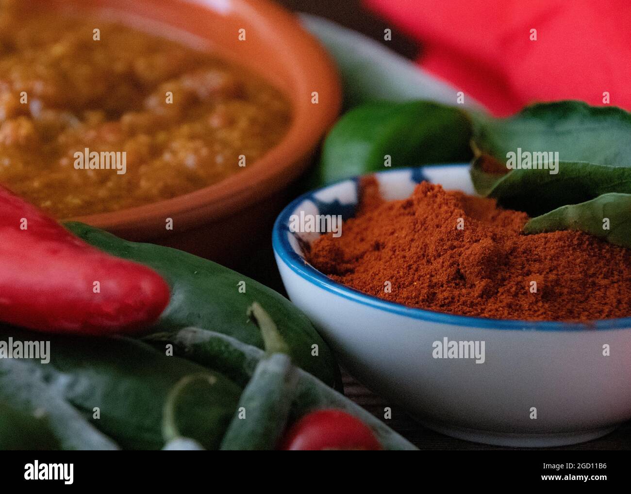 fresh grown chilli peppers and ground chilli Stock Photo - Alamy