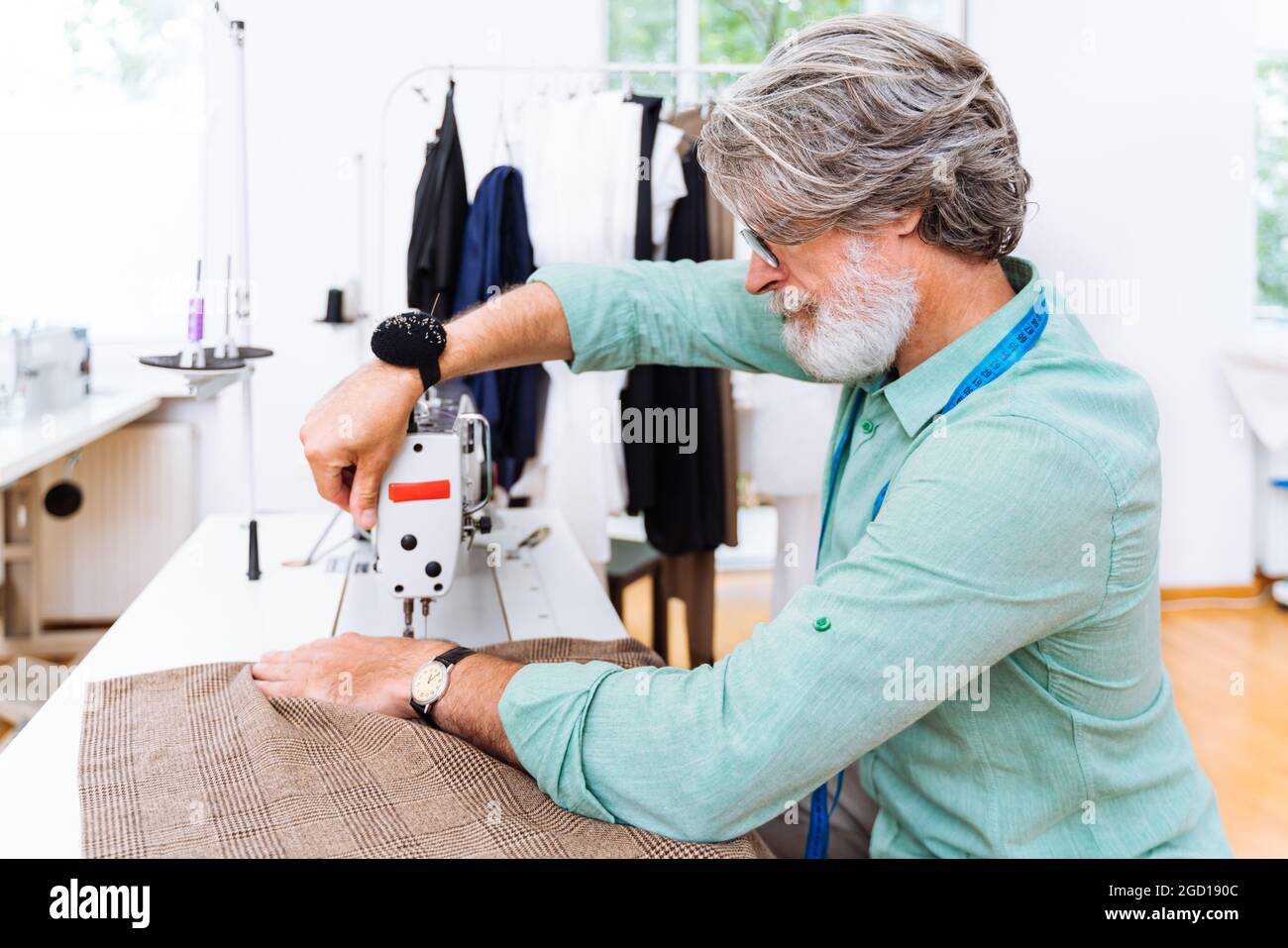 Clothing stylist creating a new design for a dress - Fashion designer ...