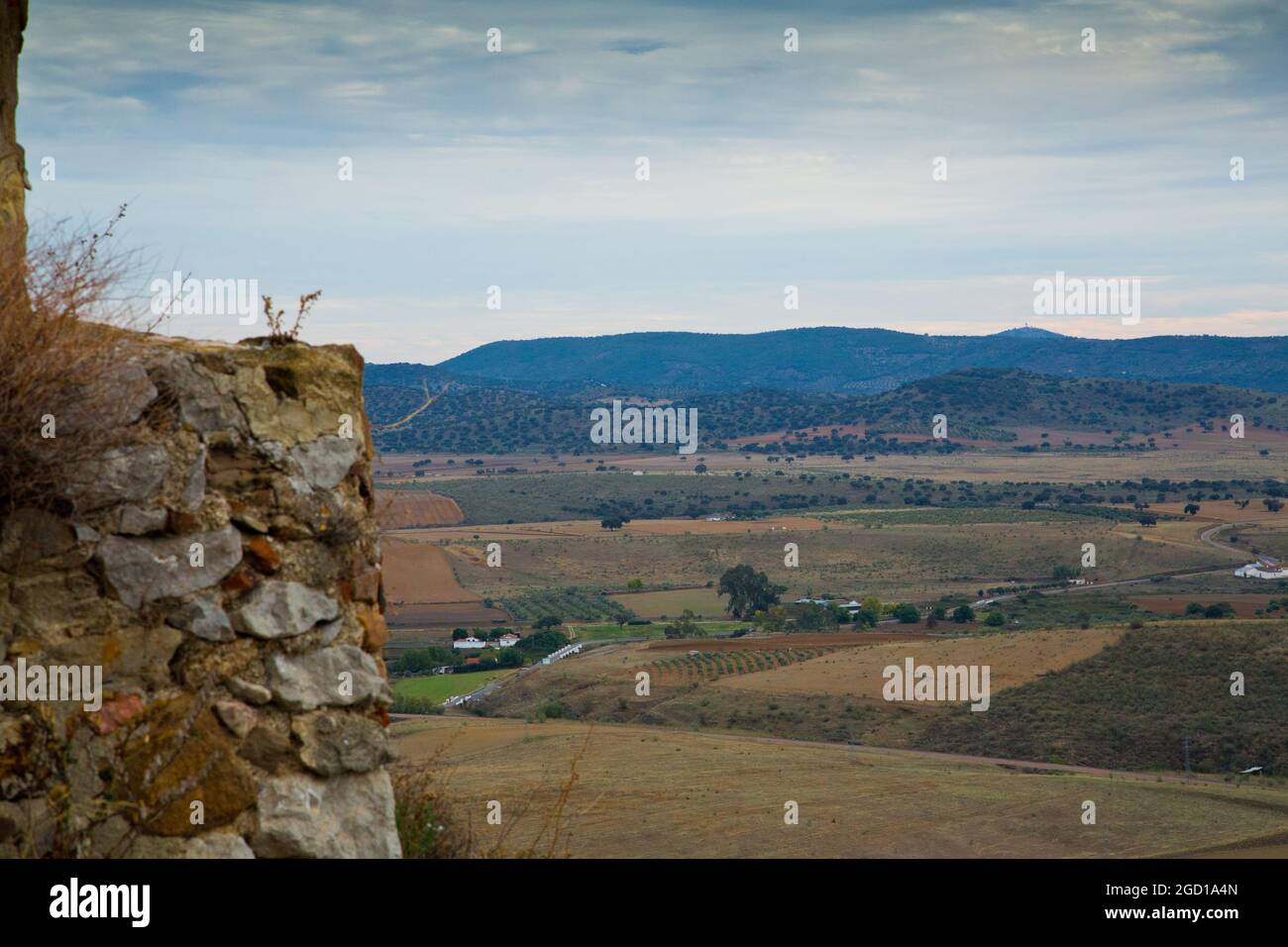Castle of brown stone construction, in the town of Belmez with tower ...