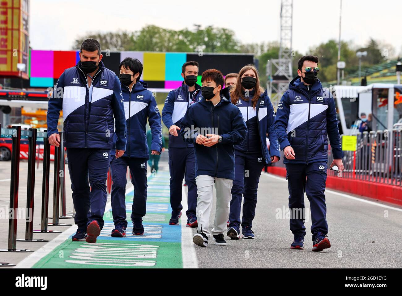 Yuki Tsunoda (JPN) AlphaTauri AT02 walks the circuit with the team ...