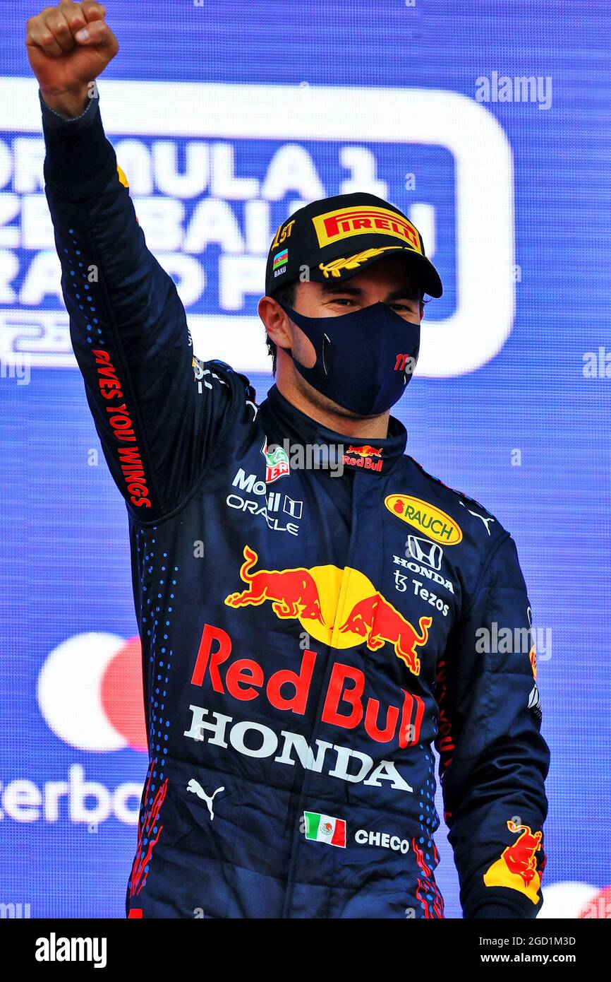 Race winner Sergio Perez (MEX) Red Bull Racing celebrates on the podium ...