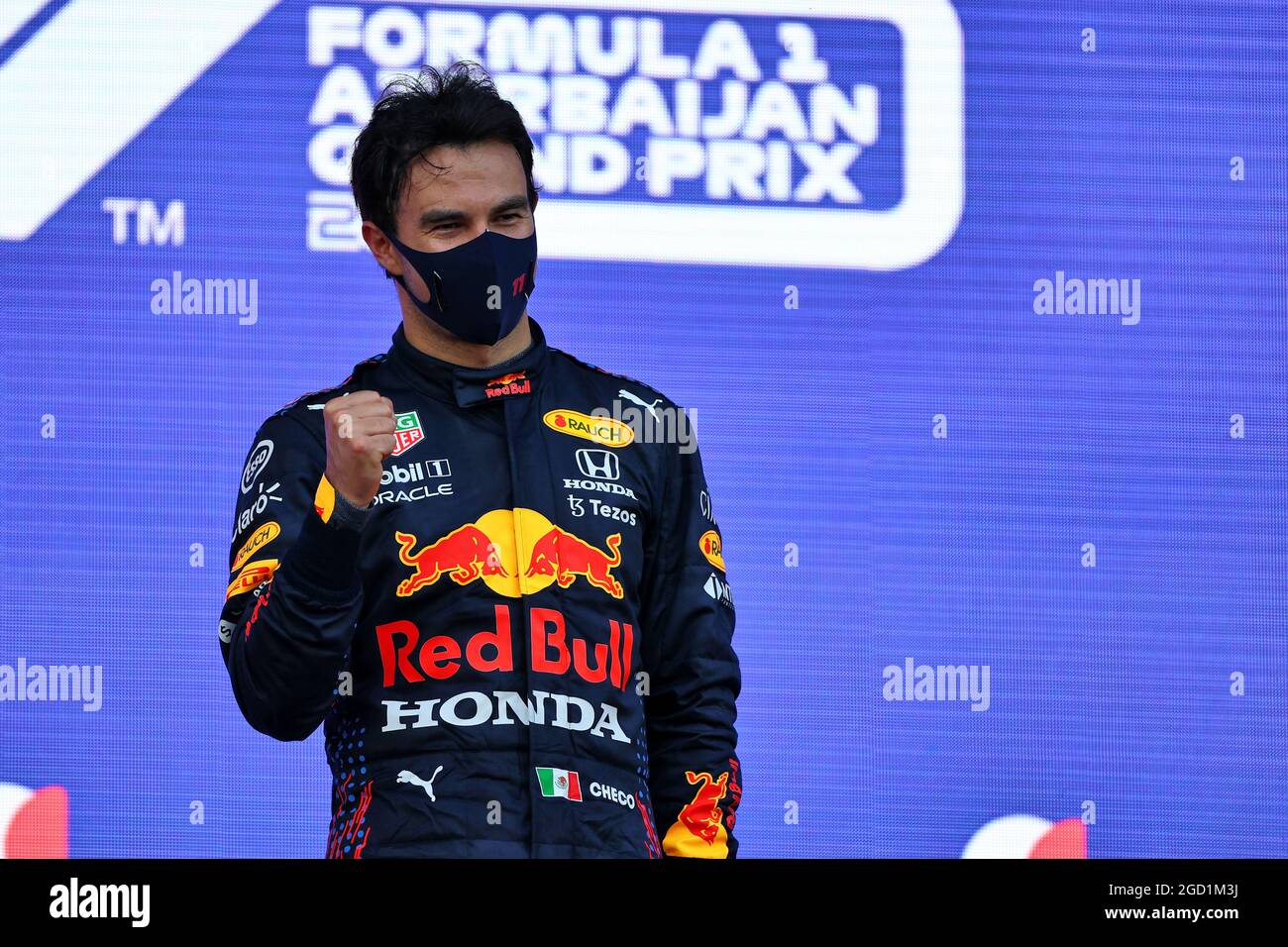 Race winner Sergio Perez (MEX) Red Bull Racing celebrates on the podium ...