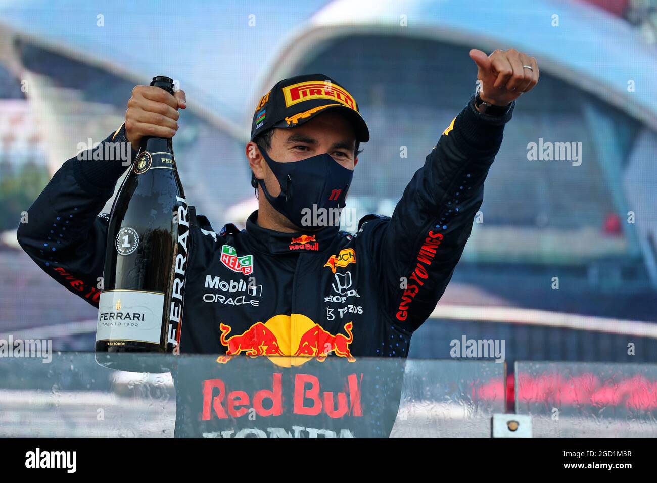 Race winner Sergio Perez (MEX) Red Bull Racing celebrates on the podium ...