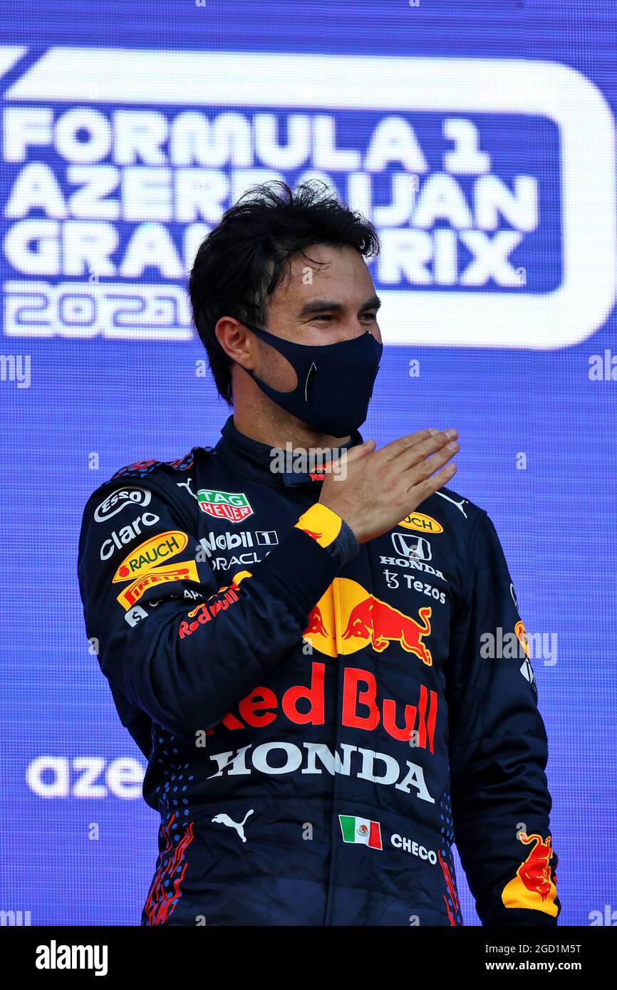 Race winner Sergio Perez (MEX) Red Bull Racing celebrates on the podium ...