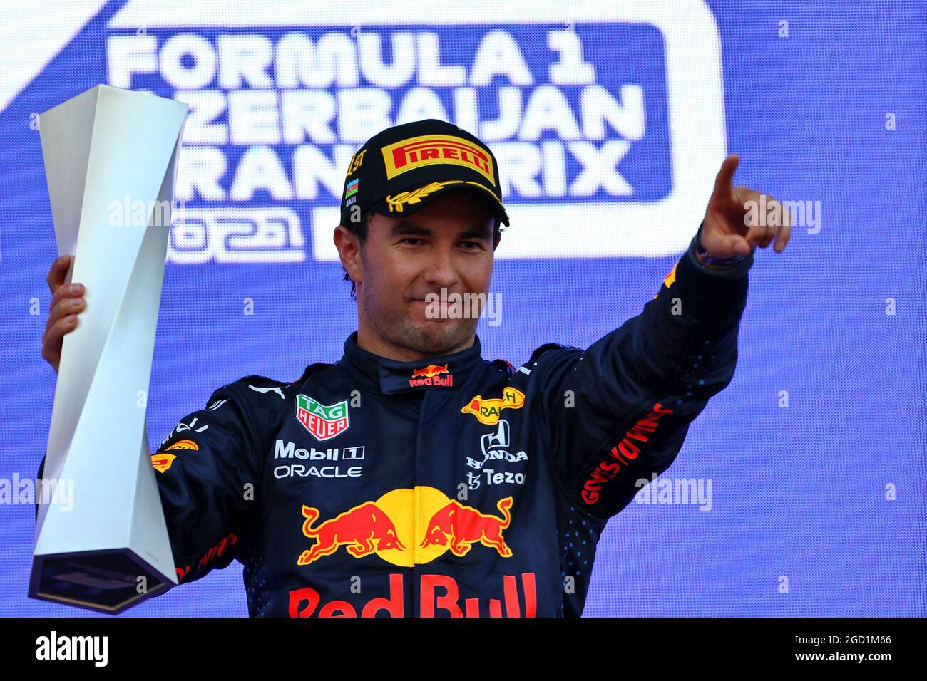 Race winner Sergio Perez (MEX) Red Bull Racing celebrates on the podium ...