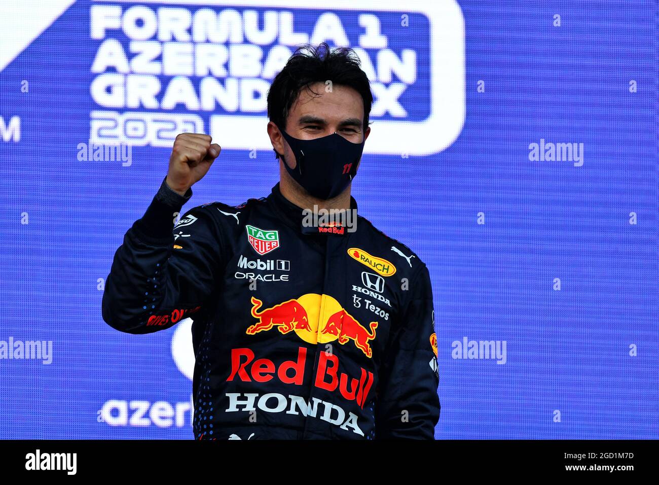 Race winner Sergio Perez (MEX) Red Bull Racing celebrates on the podium ...