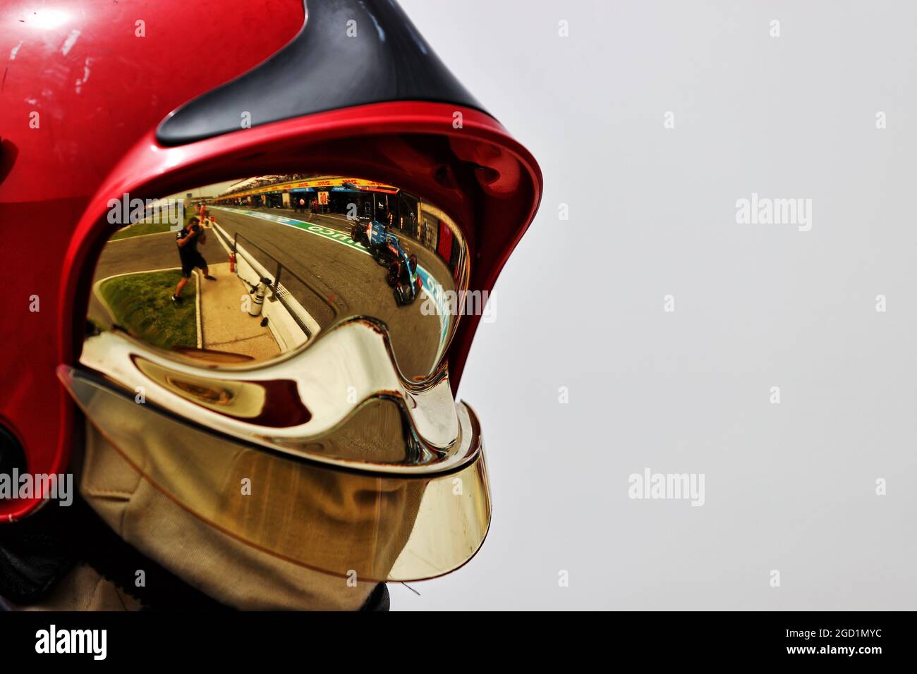 Alpine f1 team a521 reflected in fire marshals helmet visor hi-res ...