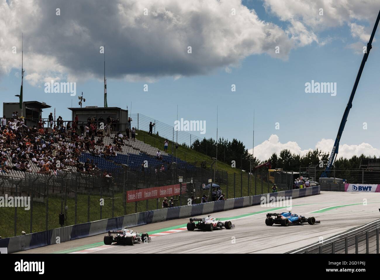 Esteban Ocon (FRA) Alpine F1 Team A521 leads Nikita Mazepin (RUS) Haas ...