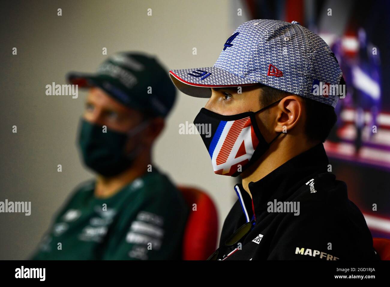Esteban Ocon (FRA) Alpine F1 Team and Sebastian Vettel (GER) Aston ...