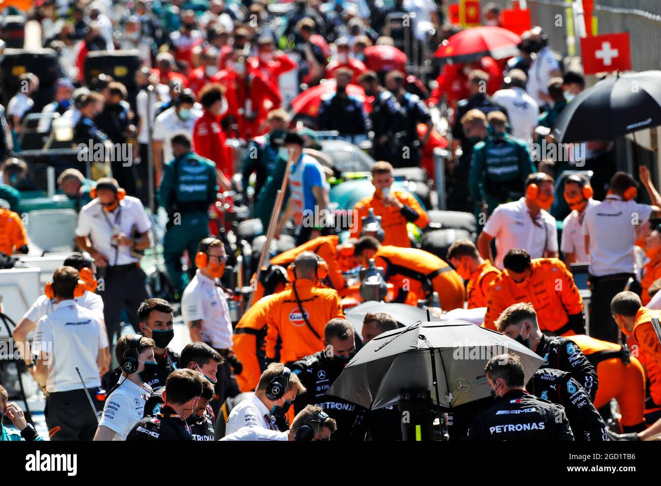 Teams in the pits while the race is stopped. British Grand Prix, Sunday ...