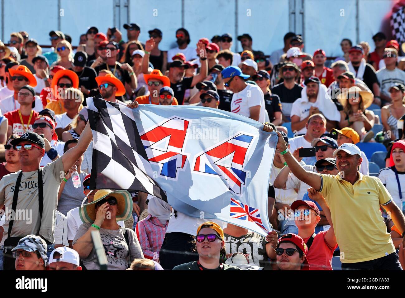 Circuit atmosphere - fans in the grandstand - flag for Lewis Hamilton ...