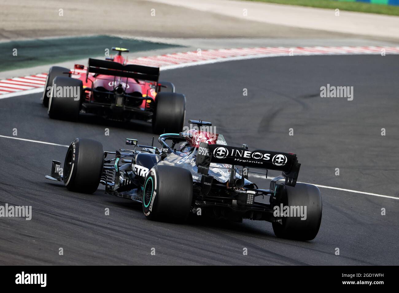 Ferrari sf 21 leads lewis hamilton hi-res stock photography and images ...